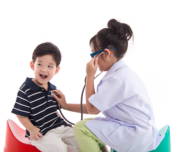 Asian children playing as doctor and patient – Central City Community ...